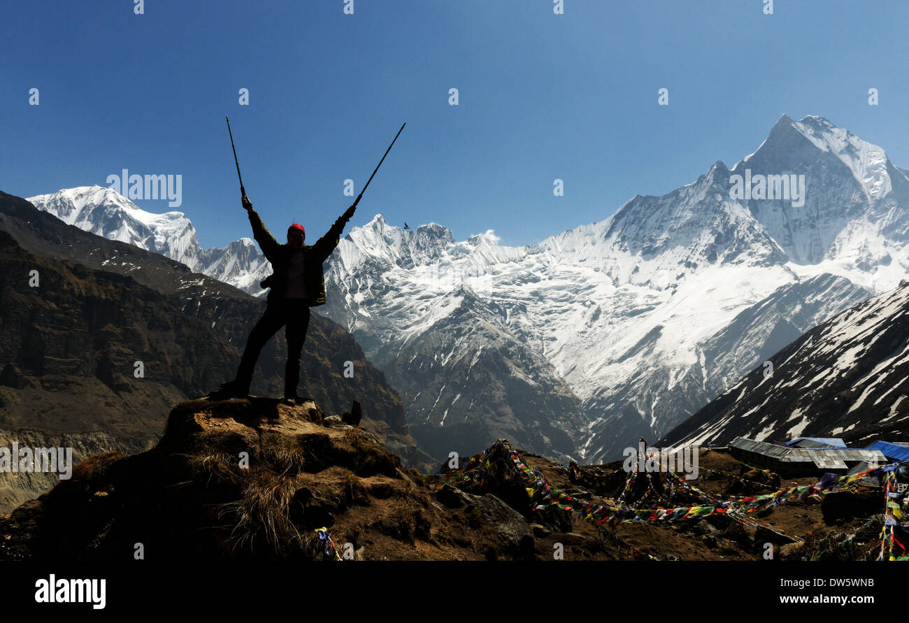 A lady trekker celebrates arriving at Annapurna Base Camp in the ...