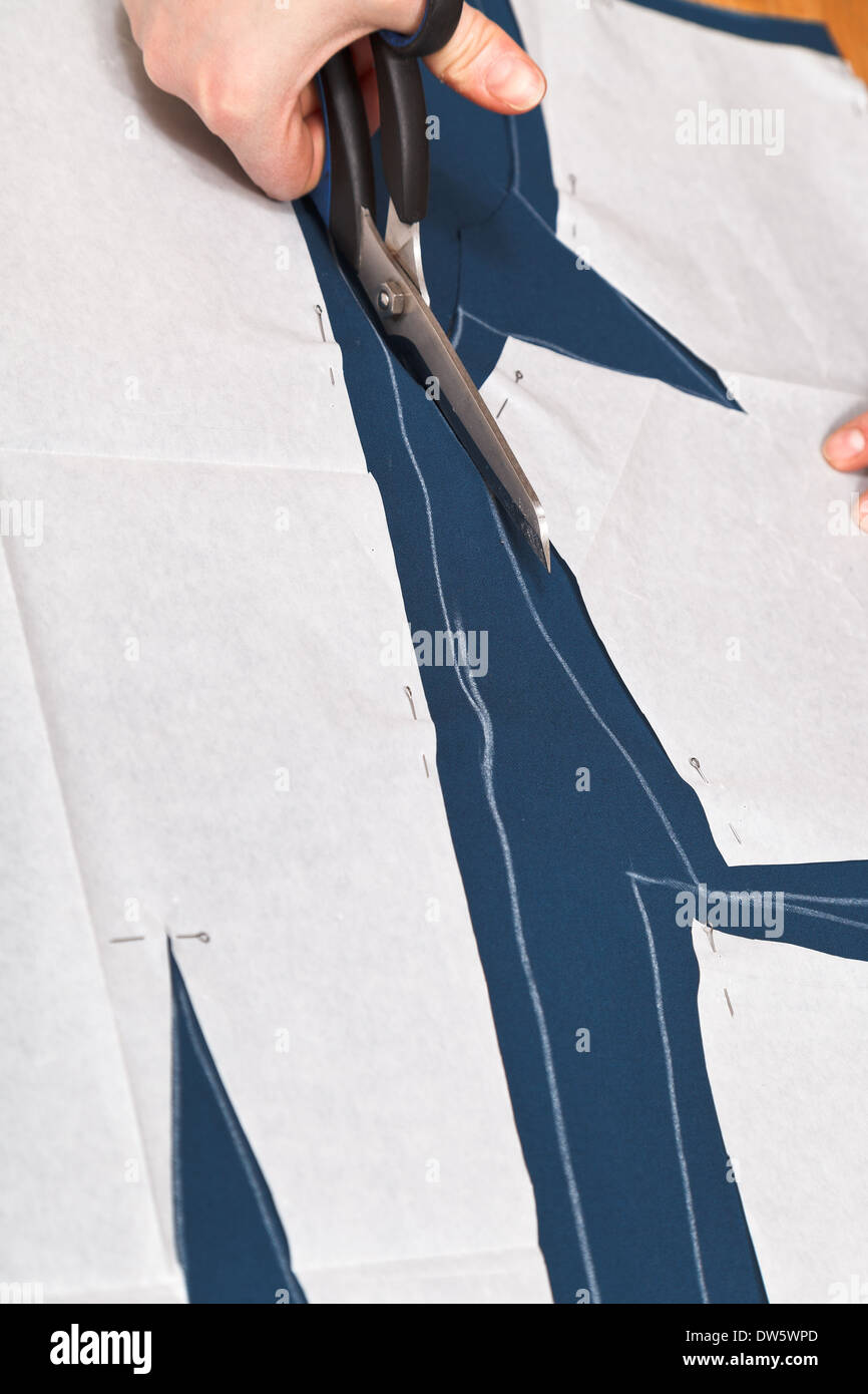 Dressmaker cuts paper sewing pattern hi-res stock photography and ...