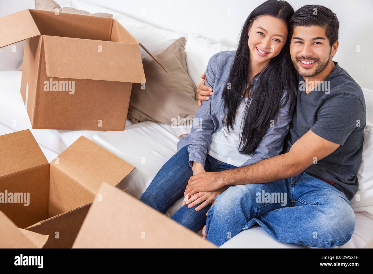 Asian man packing boxes hi-res stock photography and images - Alamy