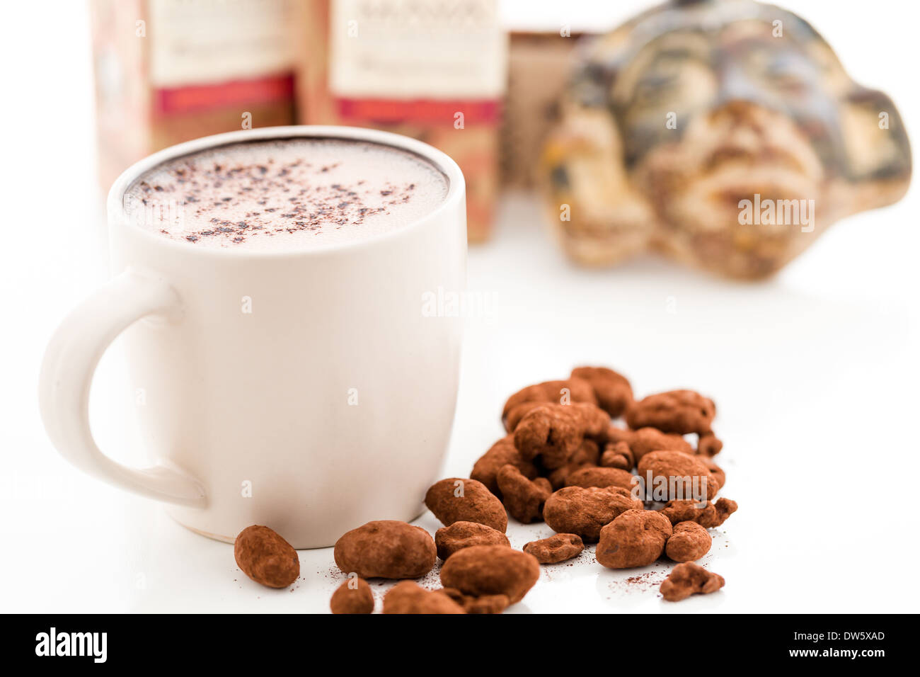 Gourmet sipping chocolate with •chocolate covered cacao beans on a ...