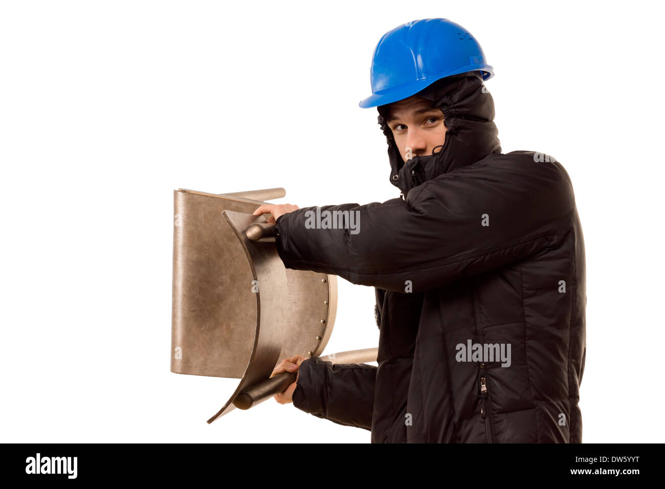 Violent teenage hooligan in a hoodie and hardhat brandishing a wooden ...