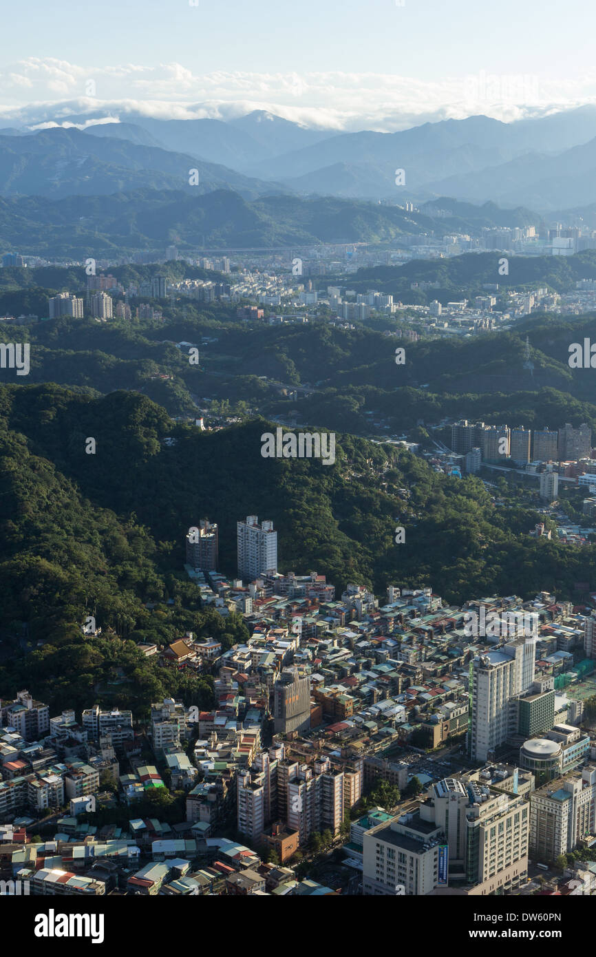 Bird's eye view of city of Taipei, Taiwan between hills in daylight ...