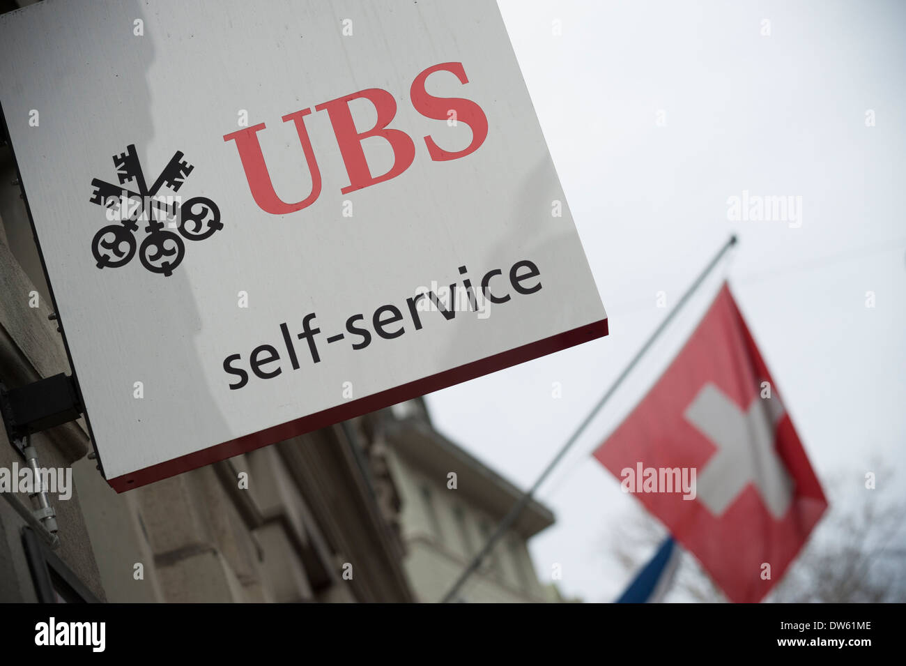 A "Self Service" sign is hanging outside an ATM branch of Switzerland's ...