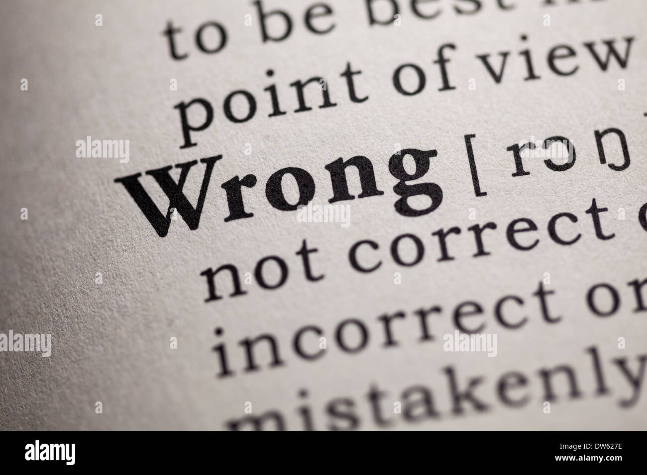 Fake Dictionary, definition of the word wrong Stock Photo - Alamy