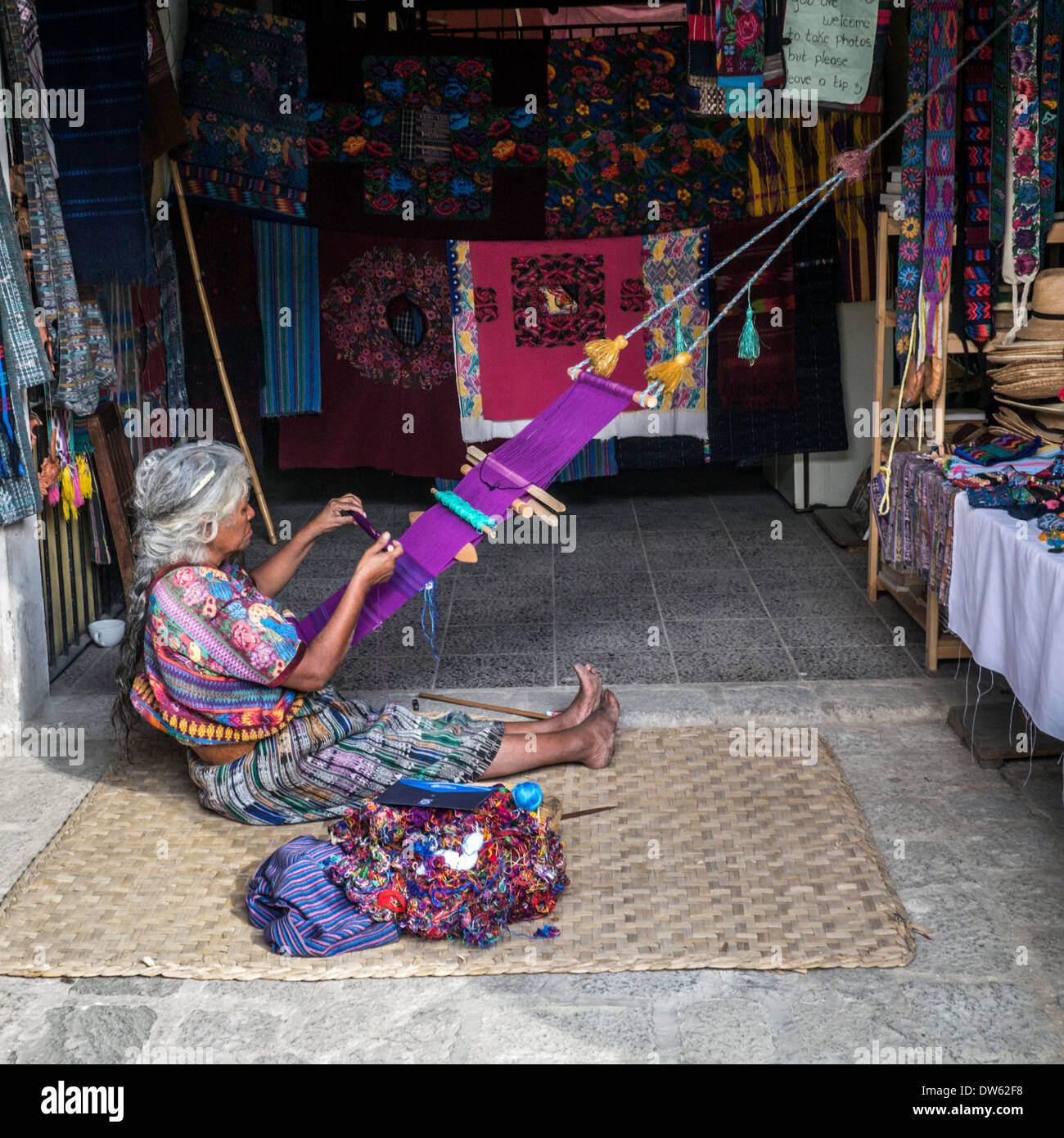 Old woman in Antigua weaves traditional cloth, Guatemala Stock Photo ...