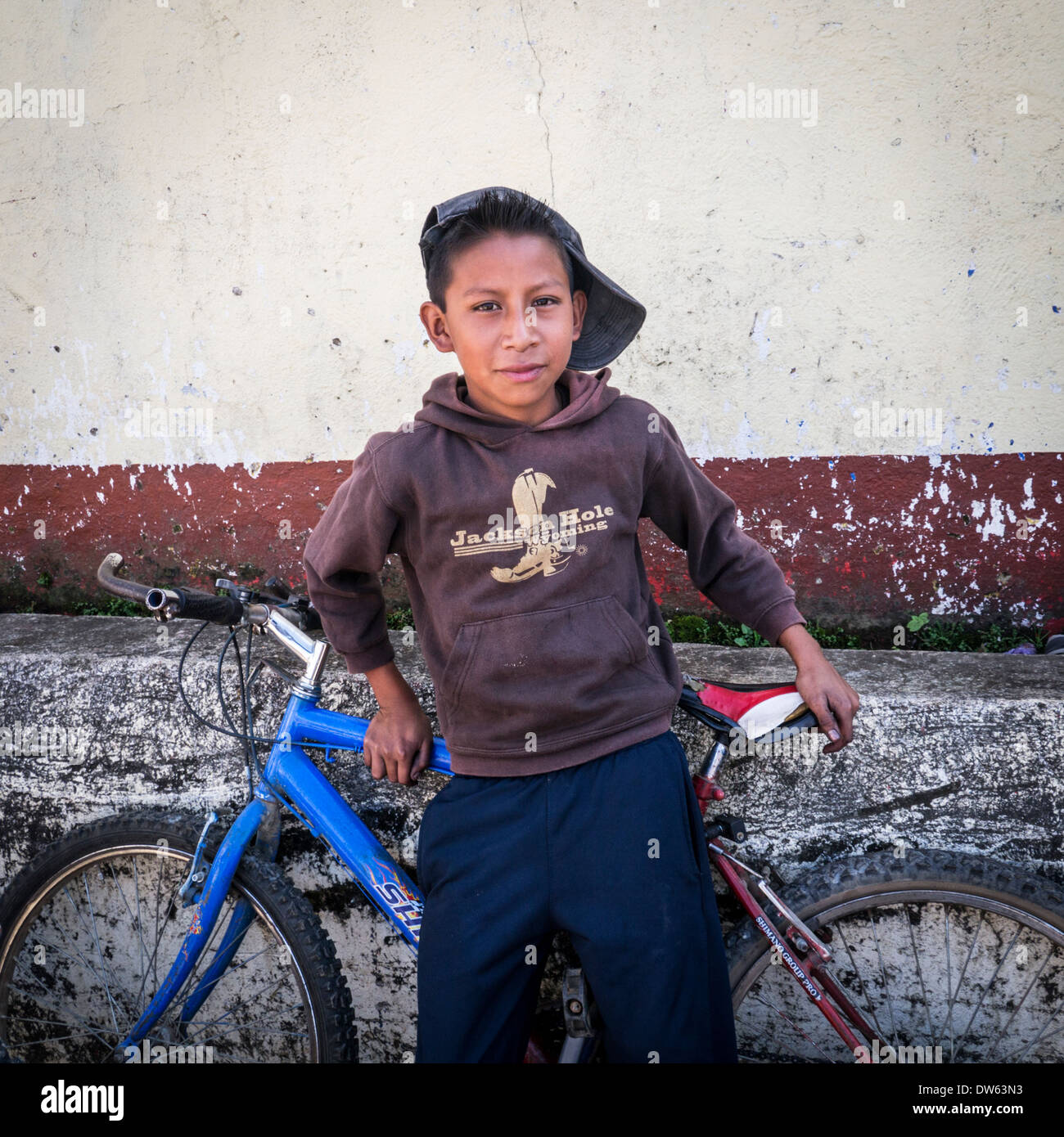 Guatemala - boy with a bicycle Stock Photo - Alamy