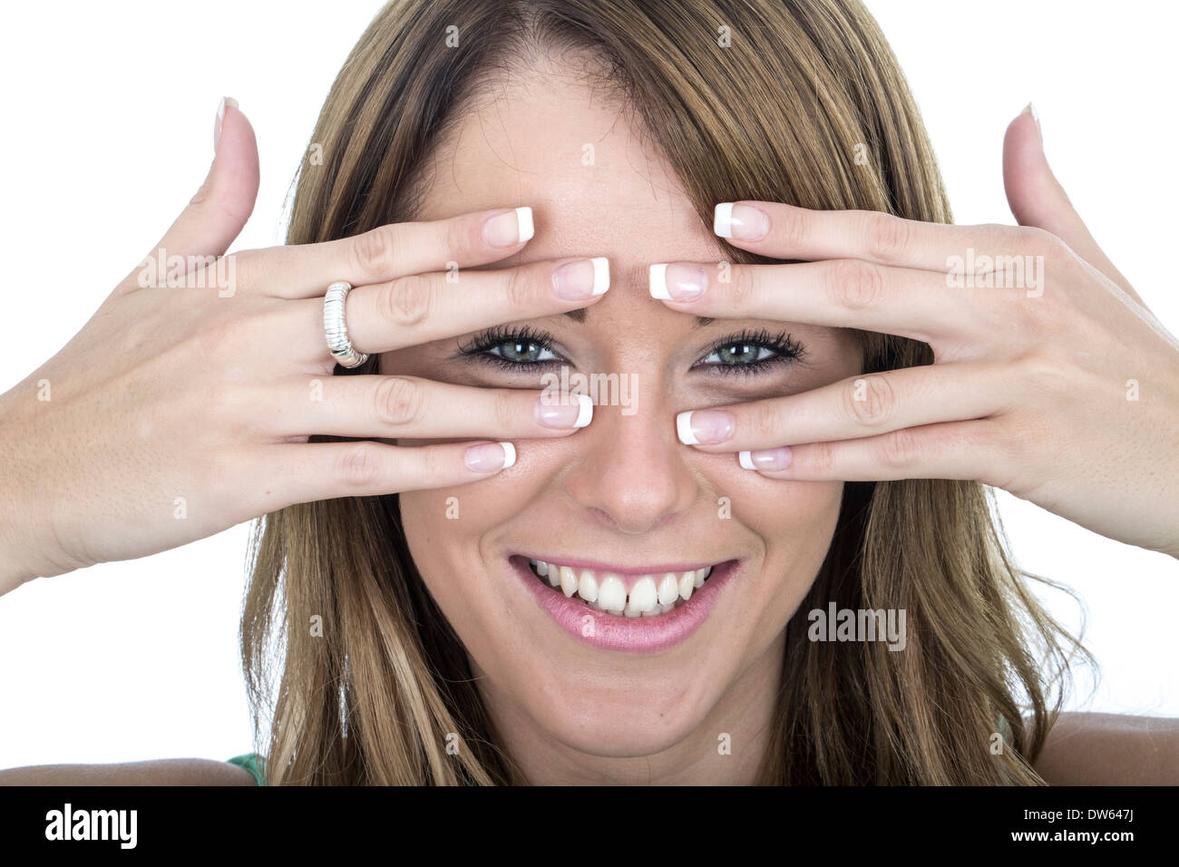 Happy Young Woman Peering Through Fingers Stock Photo - Alamy