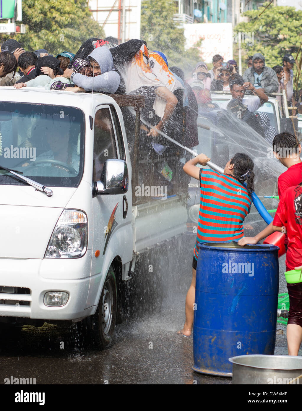 cheerful people on street, Water festival Stock Photo - Alamy