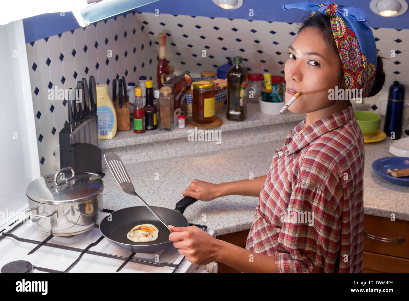 Woman smoking in kitchen hi-res stock photography and images - Alamy