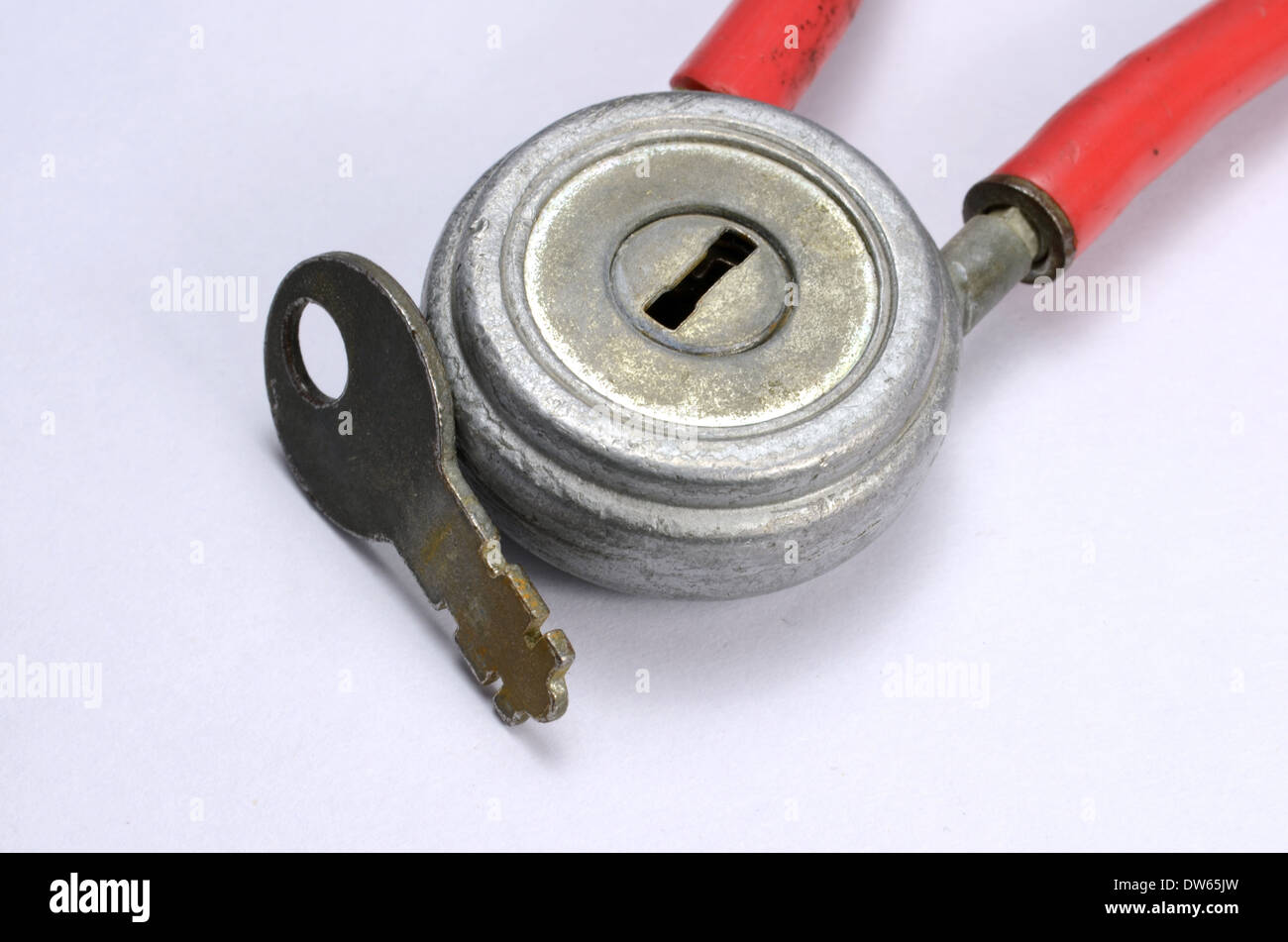 Old lock with a key on white background Stock Photo - Alamy