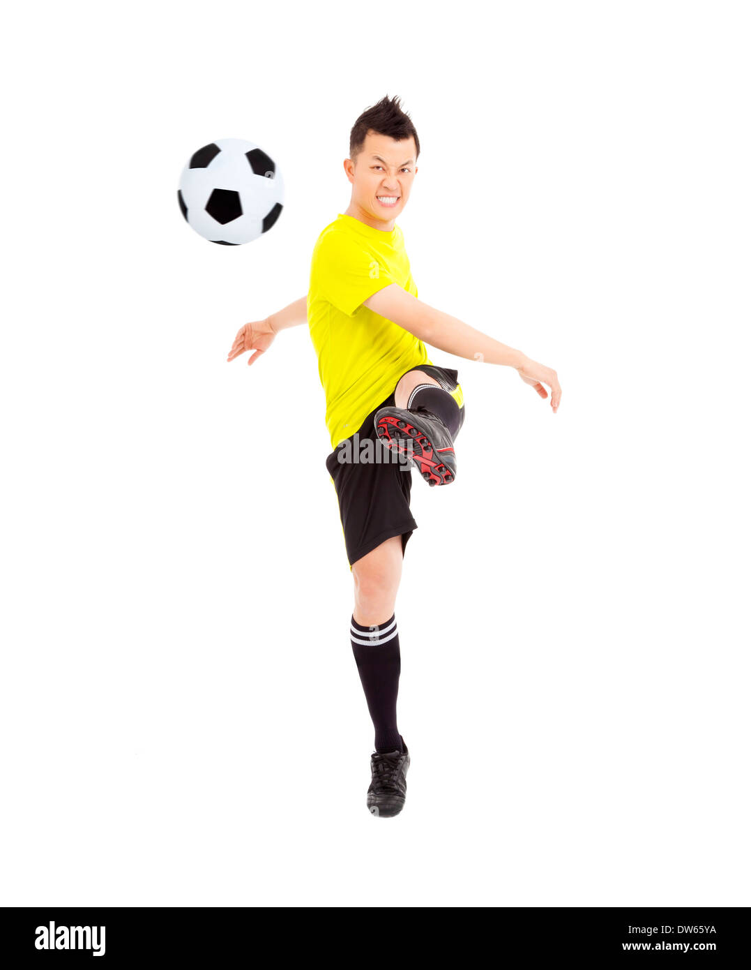 soccer player shooting a ball in studio Stock Photo - Alamy