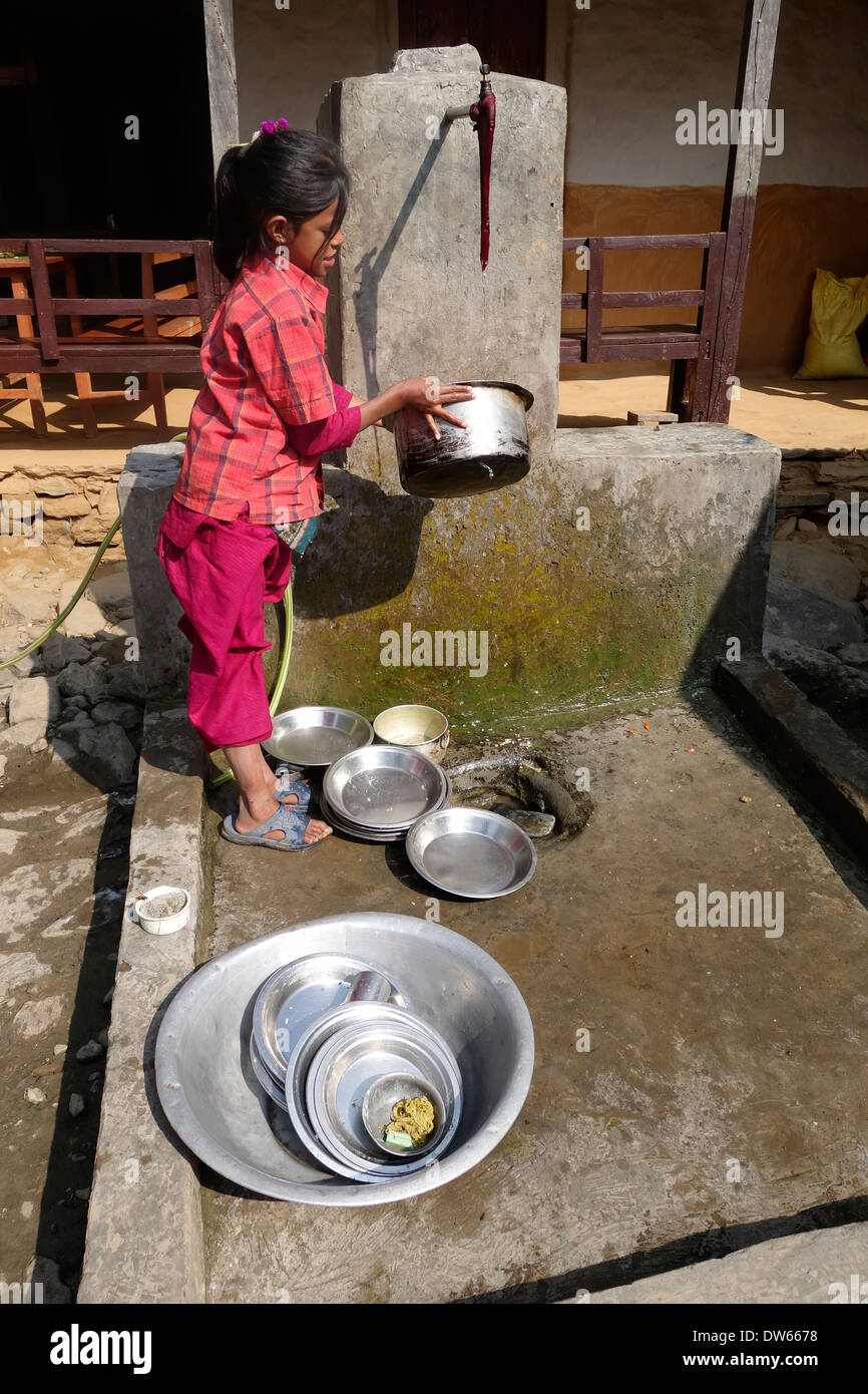 Girl washing dishes hi-res stock photography and images - Alamy