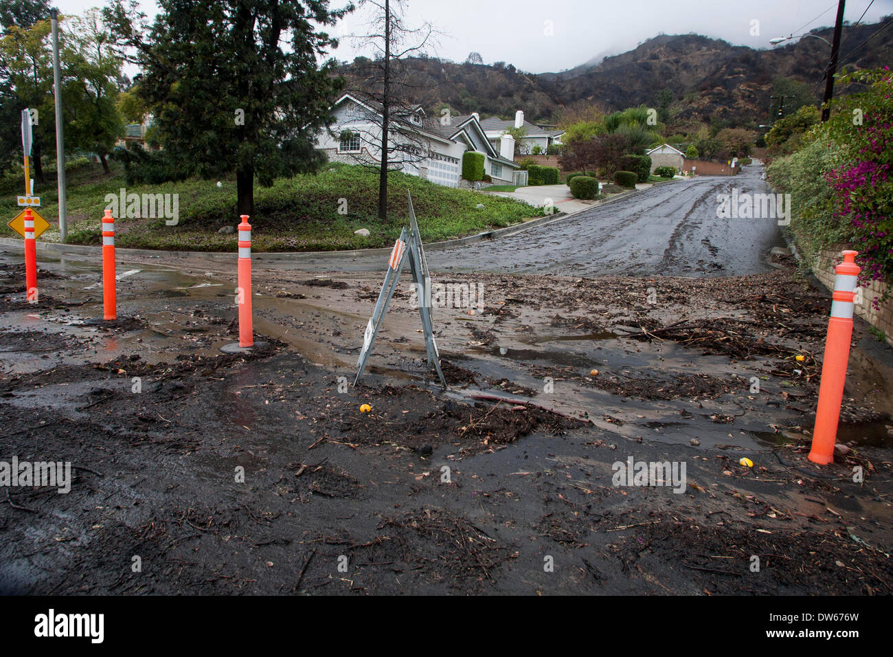 Glendora, USA. 28th Feb, 2014. Streets are covered with mud-ash debris ...