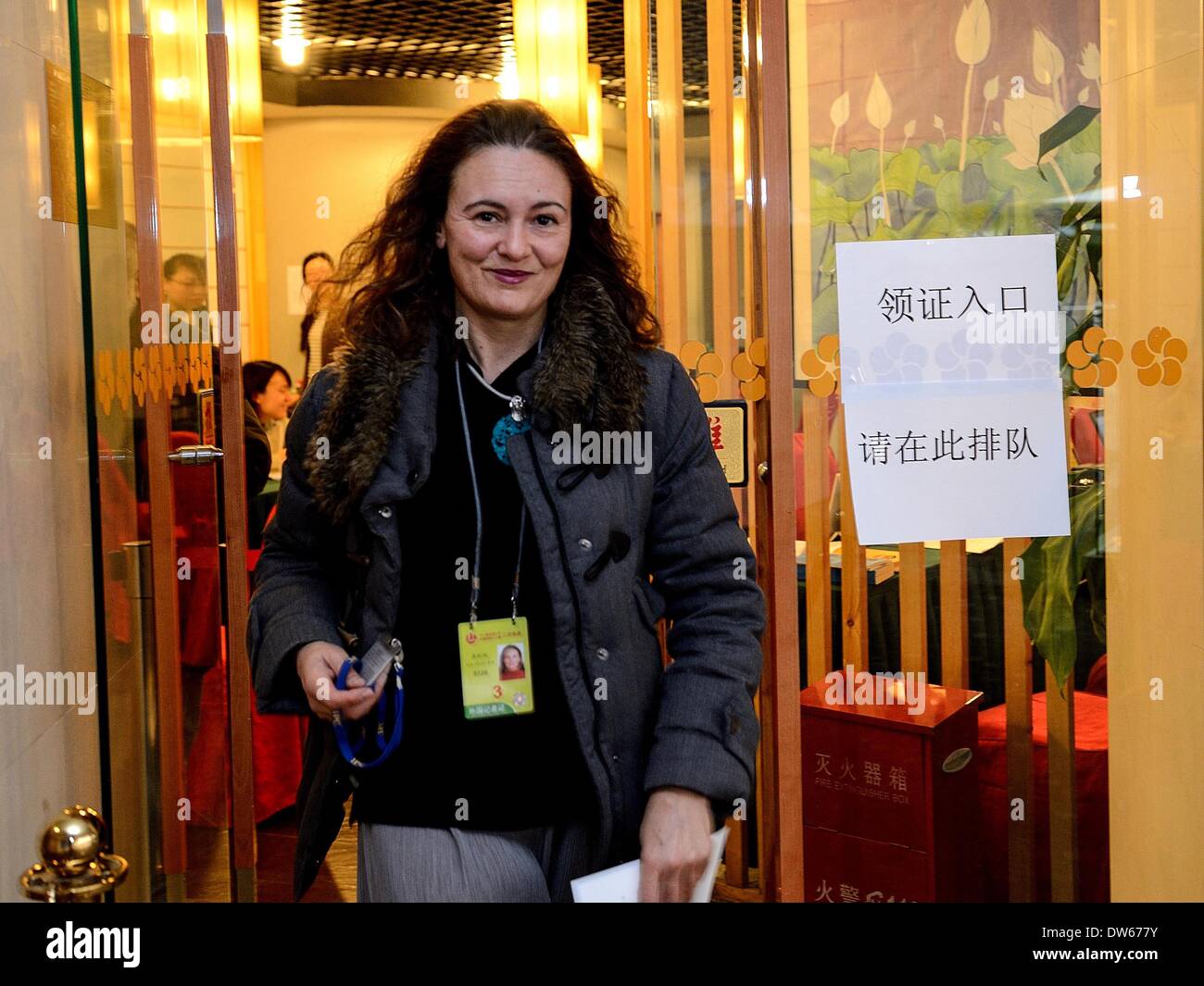 Beijing, China. 1st Mar, 2014. A French journalist leaves with her ...