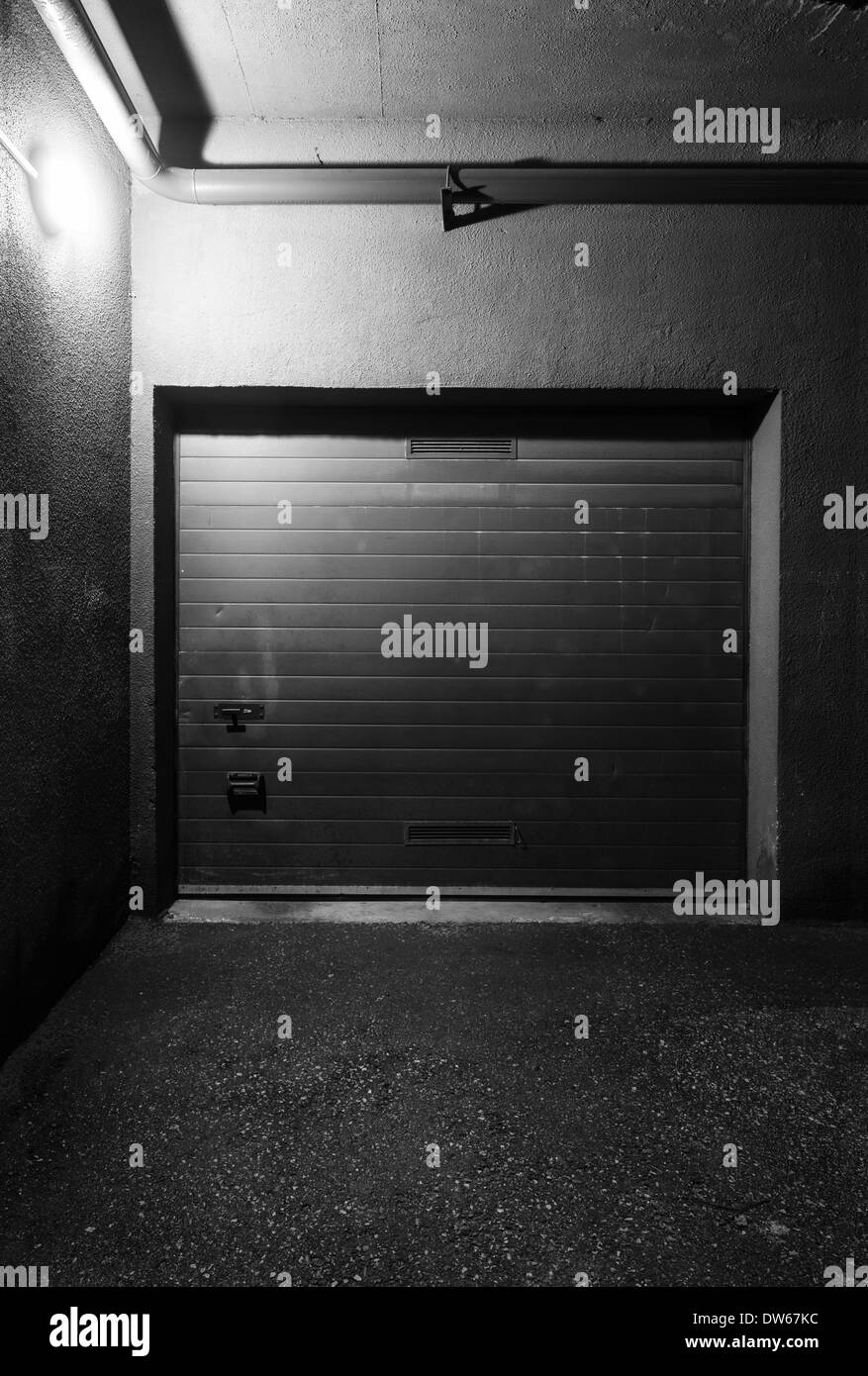 Garage doors at night Stock Photo - Alamy