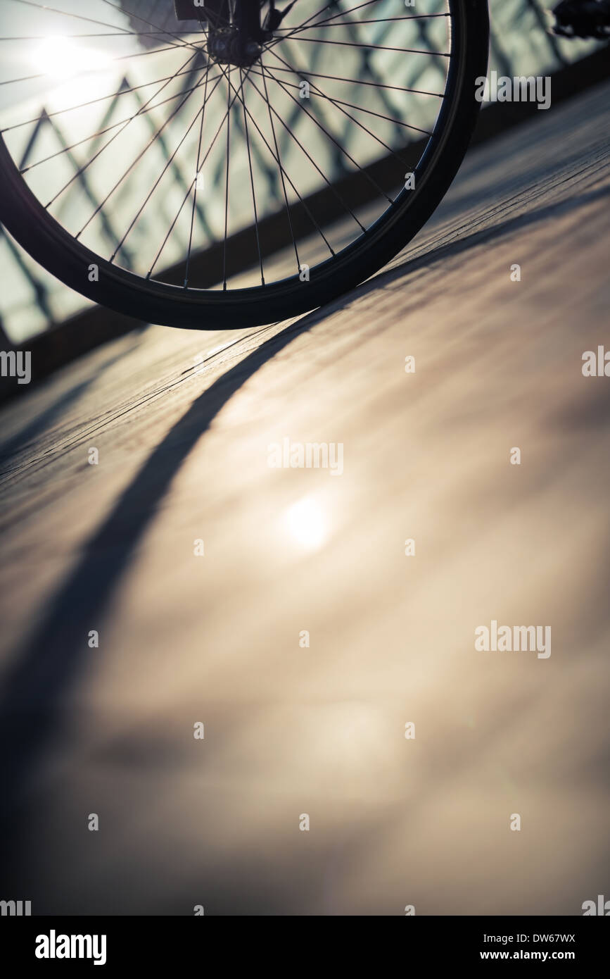Bicycle wheel in the street Stock Photo - Alamy