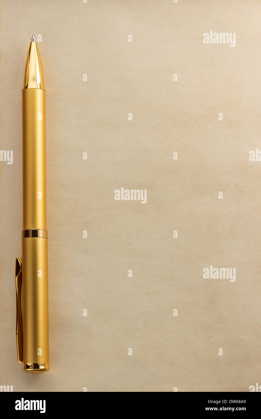gold pen on parchment background texture Stock Photo - Alamy