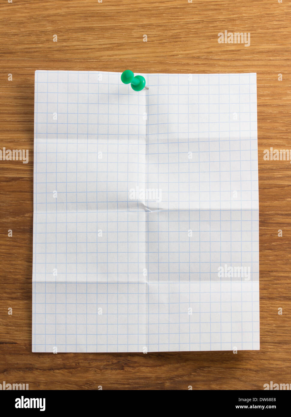 folded note paper on wooden background Stock Photo - Alamy