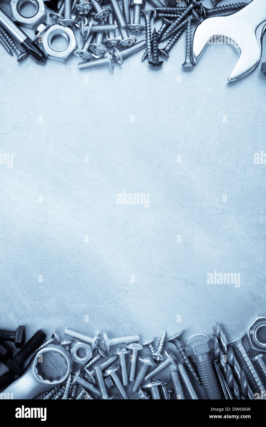 metal construction hardware tool on metal texture Stock Photo - Alamy