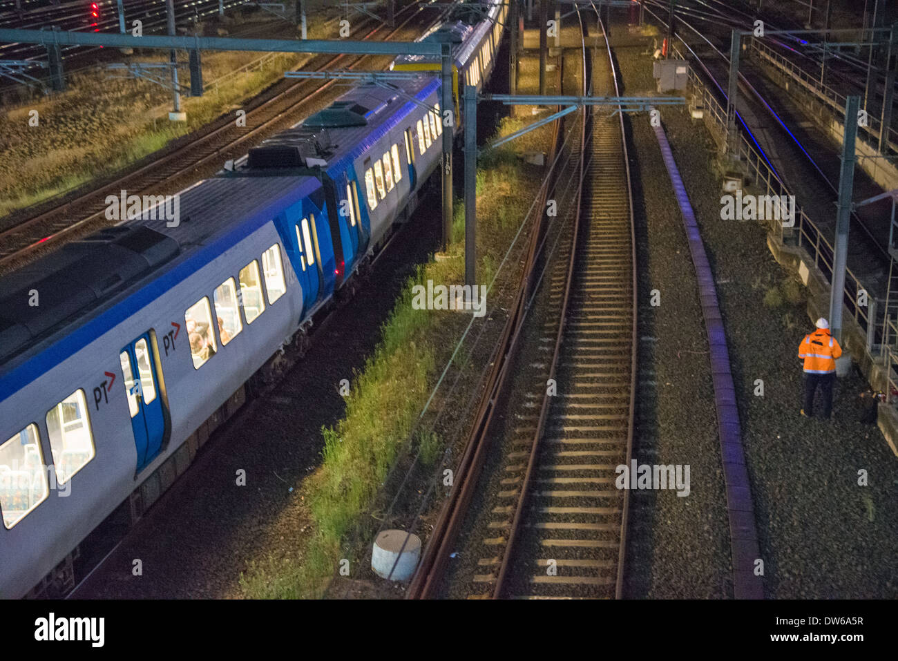 Train on train tracks leading into melbourne underground train station ...
