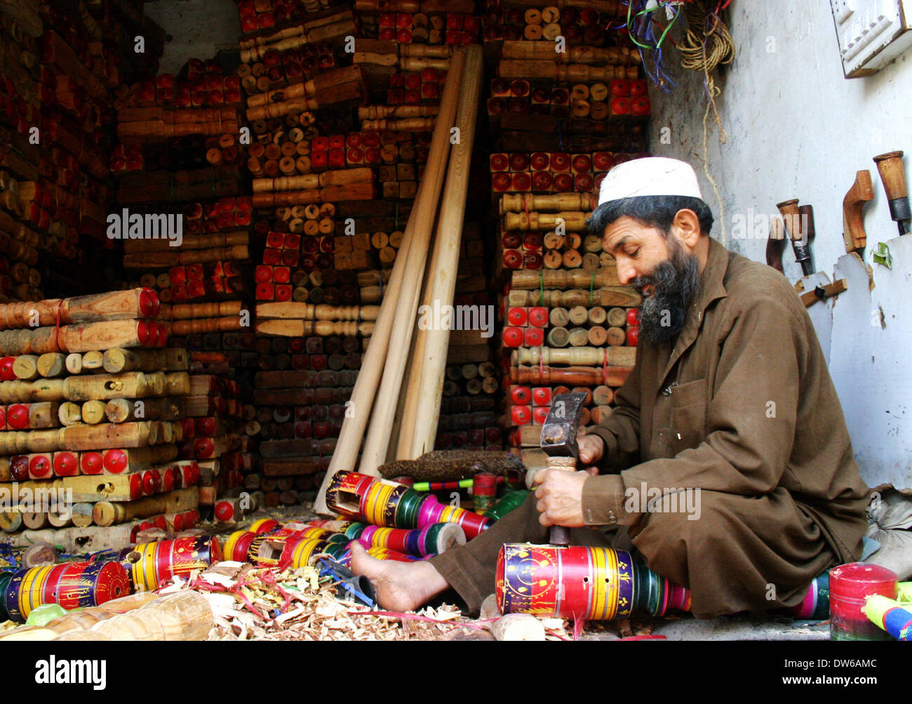 Peshawar. 1st Mar, 2014. A Pakistani man prepares decorated legs of ...