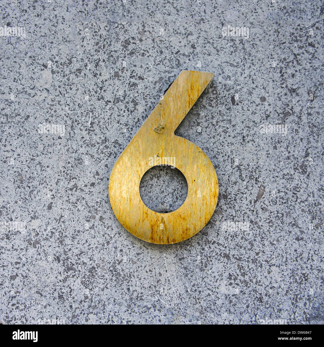 brass house number six on a gray wall Stock Photo - Alamy