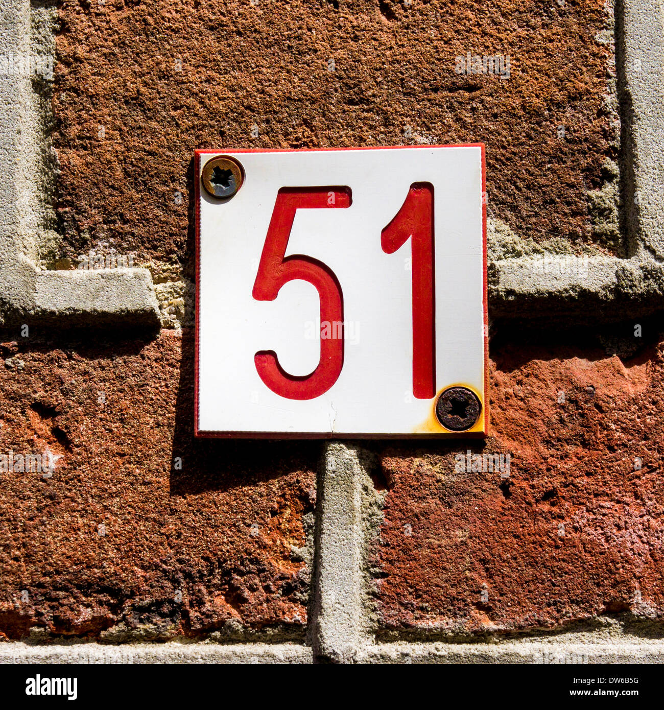 small house number fifty one, red lettering engraved in Formica Stock ...