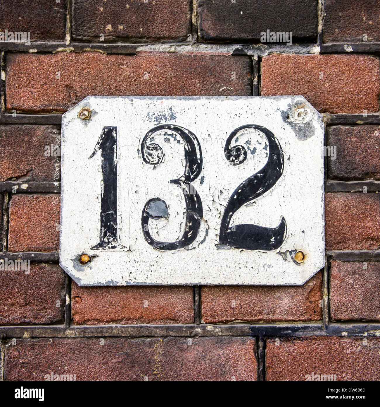 house number one hundred and thirty two. Black lettering on white ...