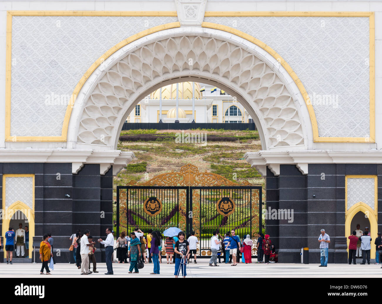 Tourists outside the massive front gate of the Istana Negara, the royal ...