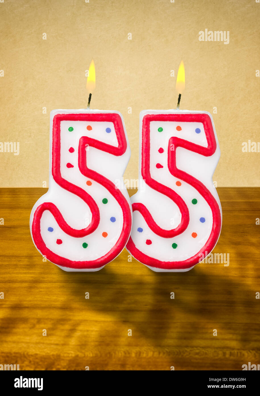 Burning birthday candles number 55 Stock Photo - Alamy
