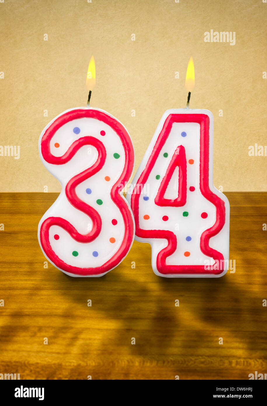 Burning birthday candles number 34 Stock Photo - Alamy
