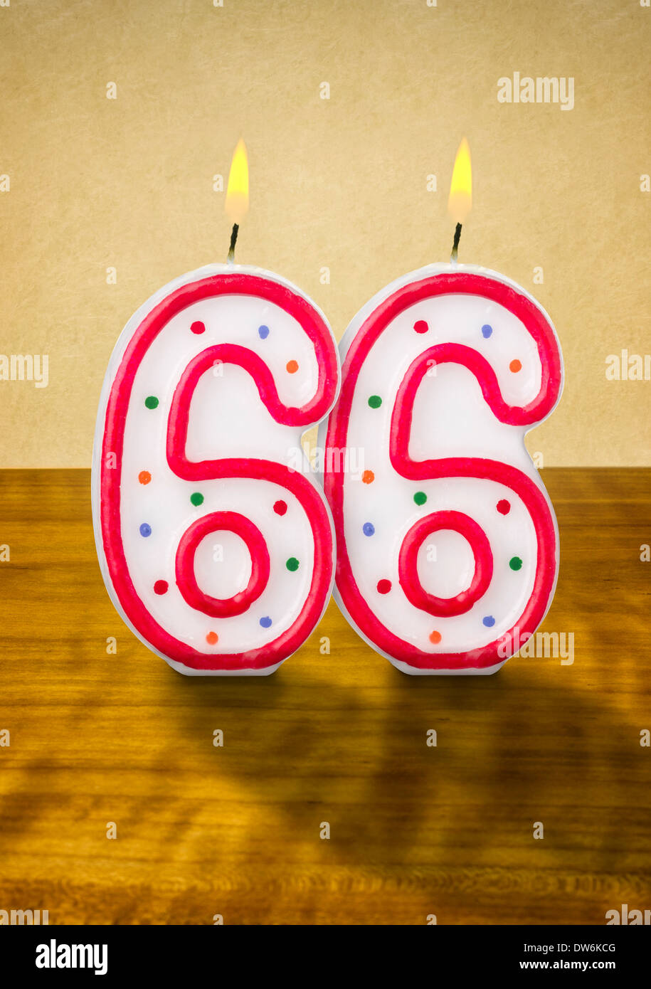 Burning birthday candles number 66 Stock Photo - Alamy