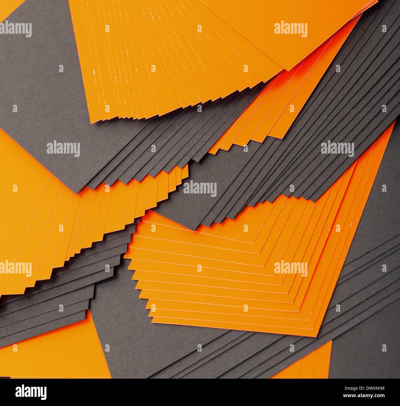 Black and orange sheets paper closeup background Stock Photo - Alamy