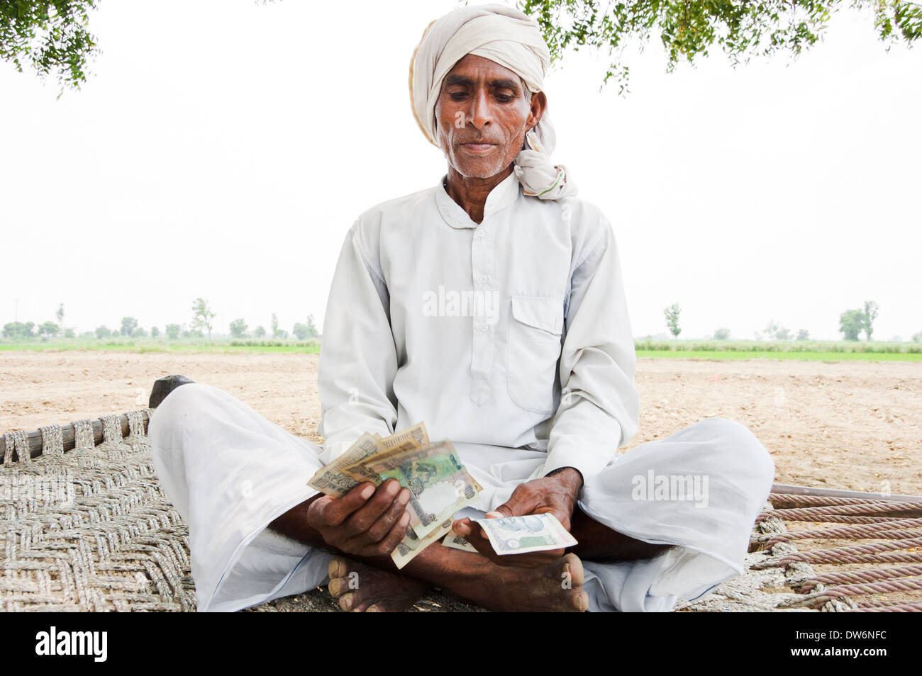 Indian seniors adult man money hi-res stock photography and images - Alamy
