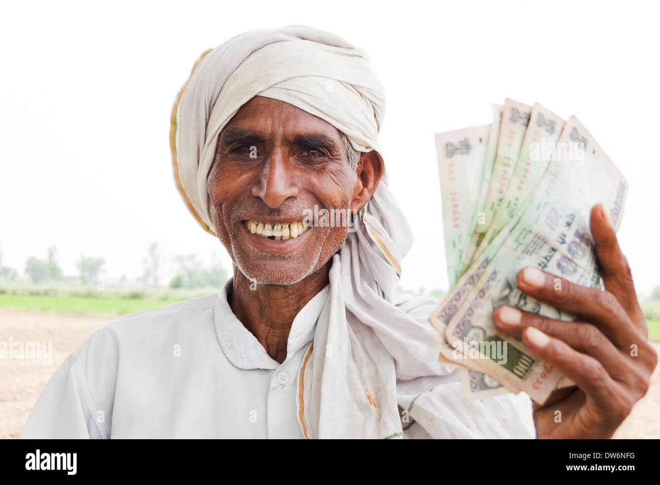 1 Indian farmer showing money Stock Photo - Alamy