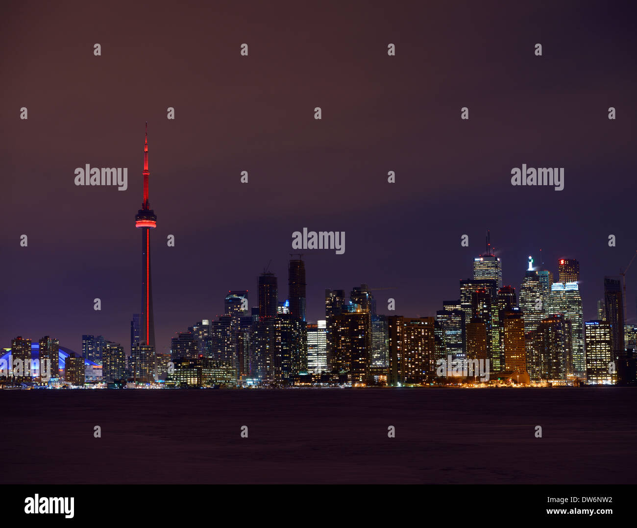 Lights of Toronto city skyline at night in winter from frozen snow ...