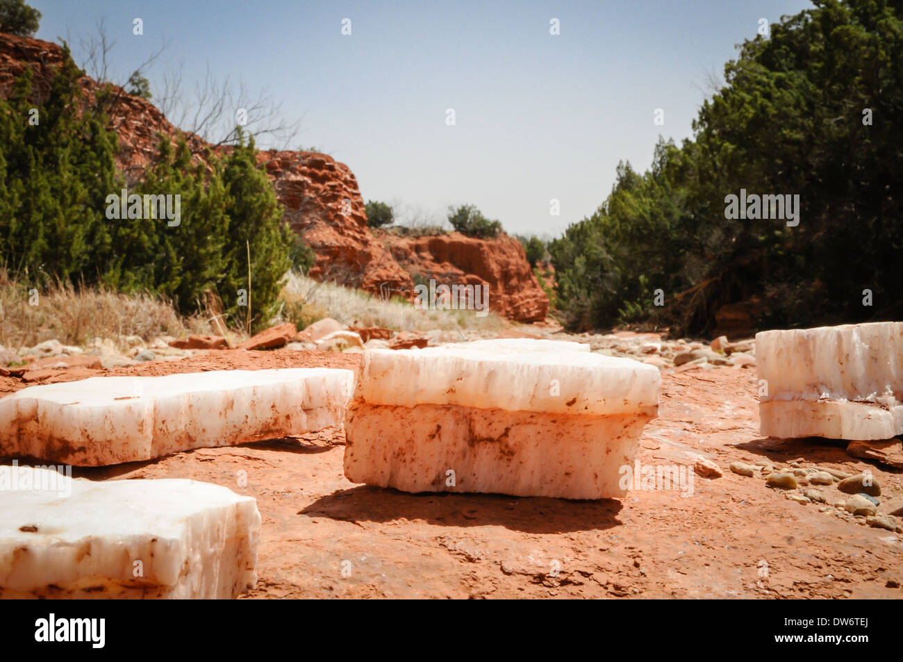 Close up of a piece of white quartz in a red rock canyon of Caprock ...