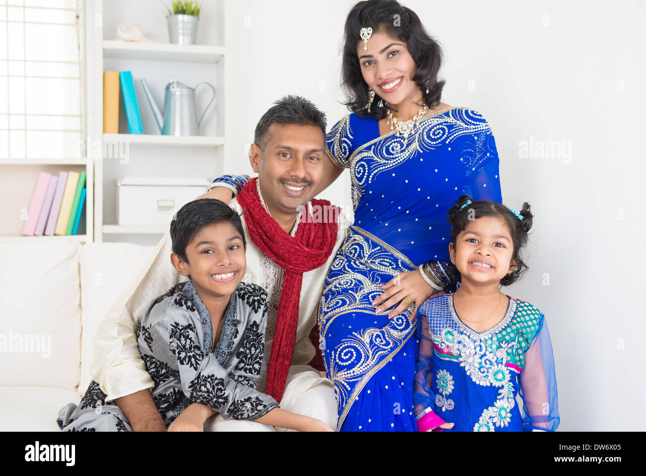 Portrait of happy Indian family at home. Living lifestyle of parents ...