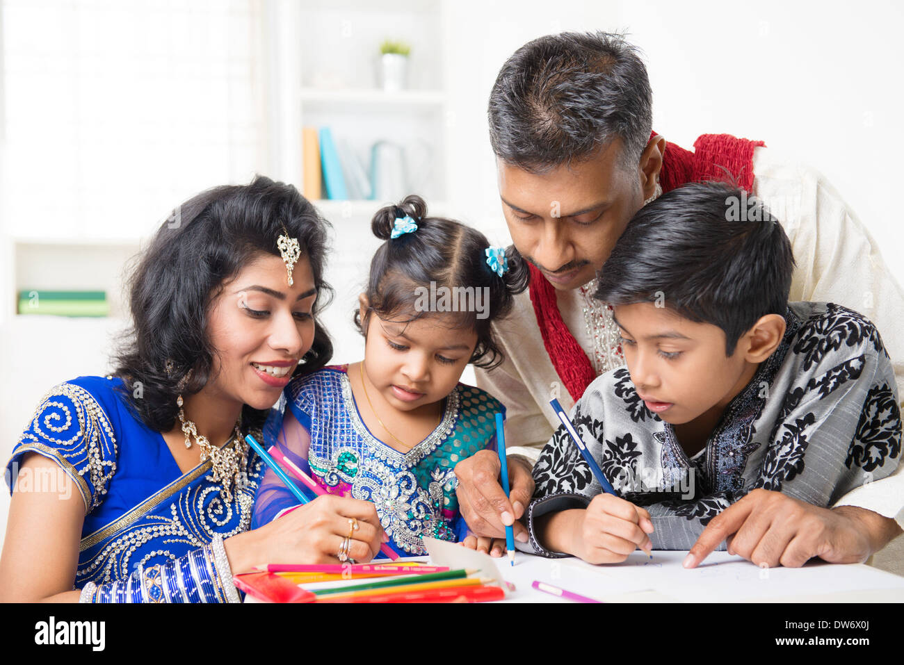 Indian parents teaching children hi-res stock photography and images ...
