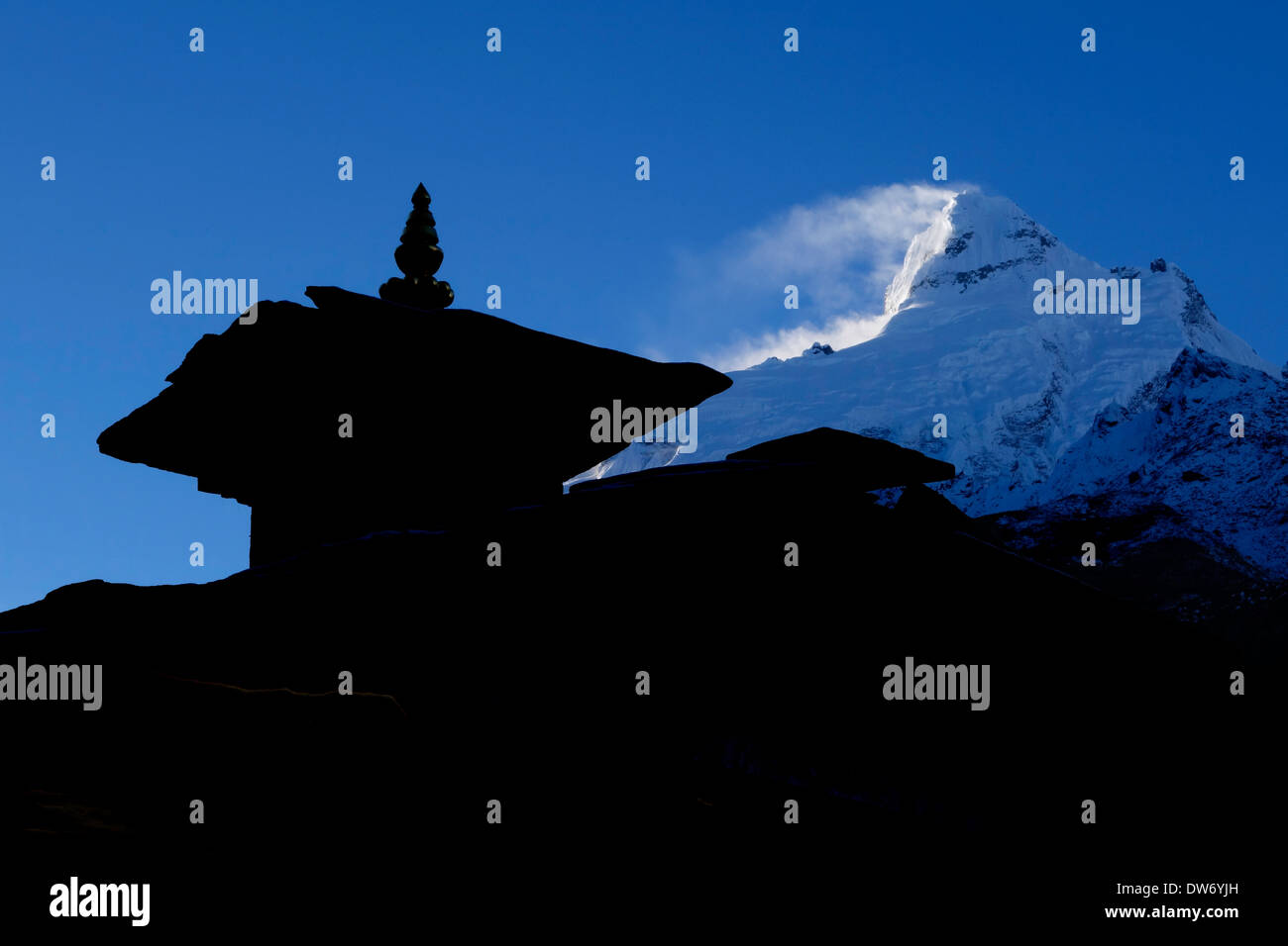 Stupa of the Gumba Lungdang Monastery and snow blowing off a peak in ...