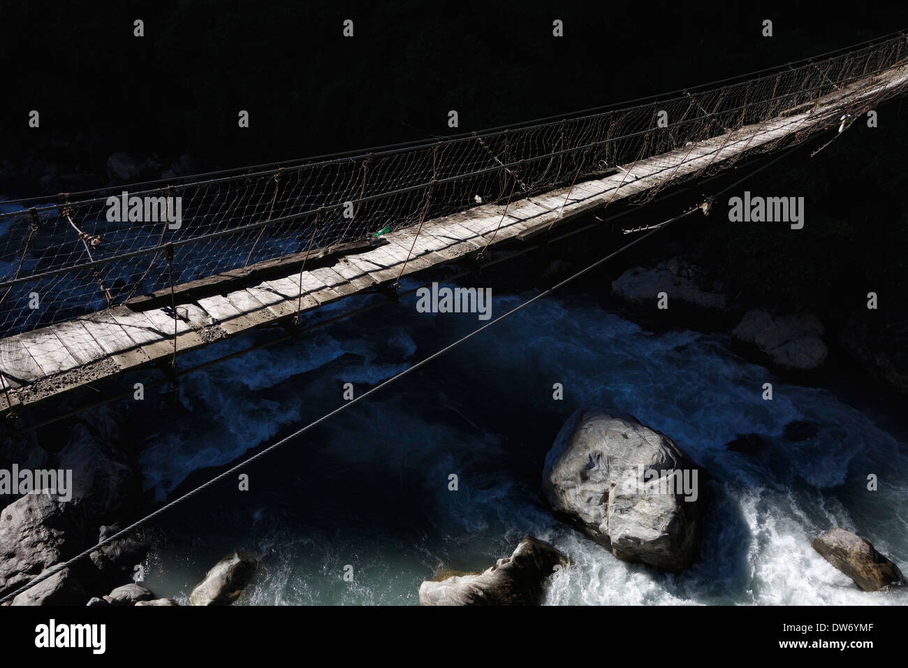 Suspension bridge over the Budhi Gandaki River in the Manaslu region of ...