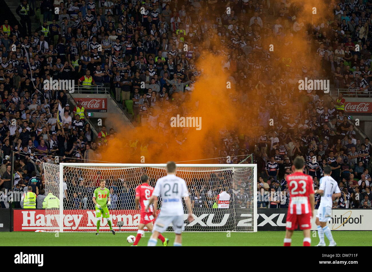 Melbourne, Australia. 1st March 2014. A flare is let off in the crowd ...