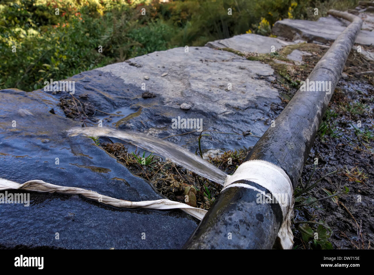 Leaking water pipe along the Annapurna road near the village of ...