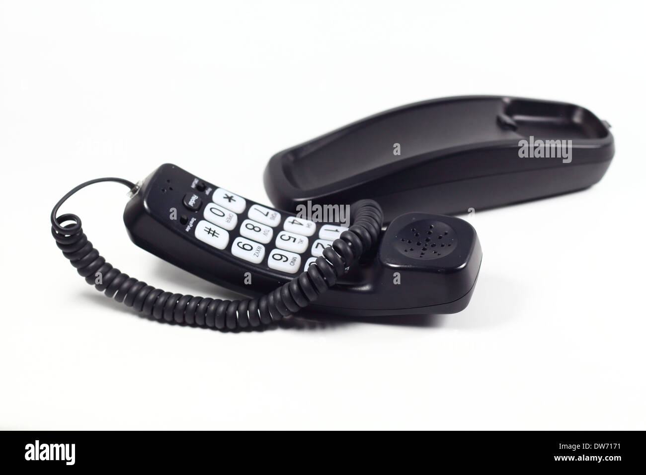 Black telephone on white background Stock Photo - Alamy