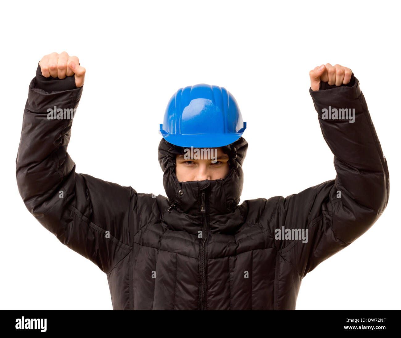 Belligerent young thug raising his arms in a threatening gesture as he ...