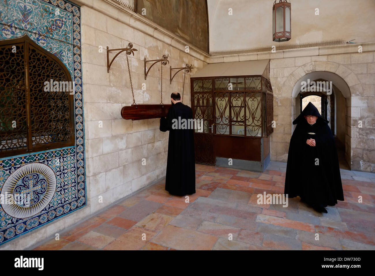 Members of the Armenian Apostolic church using a wooden "Nakos" which ...