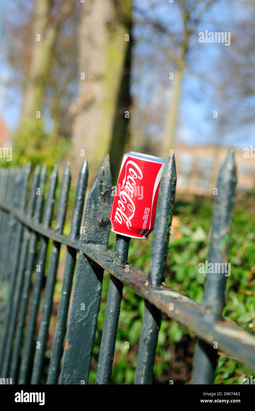 Coca Cola Can On Iron Railing Fence Stock Photo - Alamy