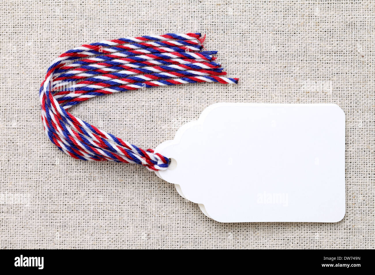 blank tag or label on burlap background Stock Photo - Alamy