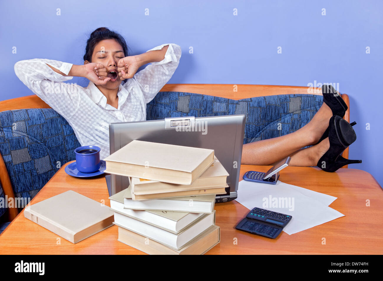 Tired woman working on computer Stock Photo - Alamy