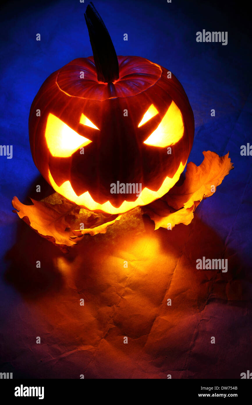Angry halloween pumpkin with oak leaves Stock Photo - Alamy